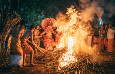 Experience Intense and Colorful Theyyam Fire Ceremony in Kerala India